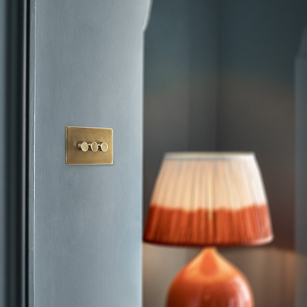 Three gang 2 way Florence dimmer switch in brass