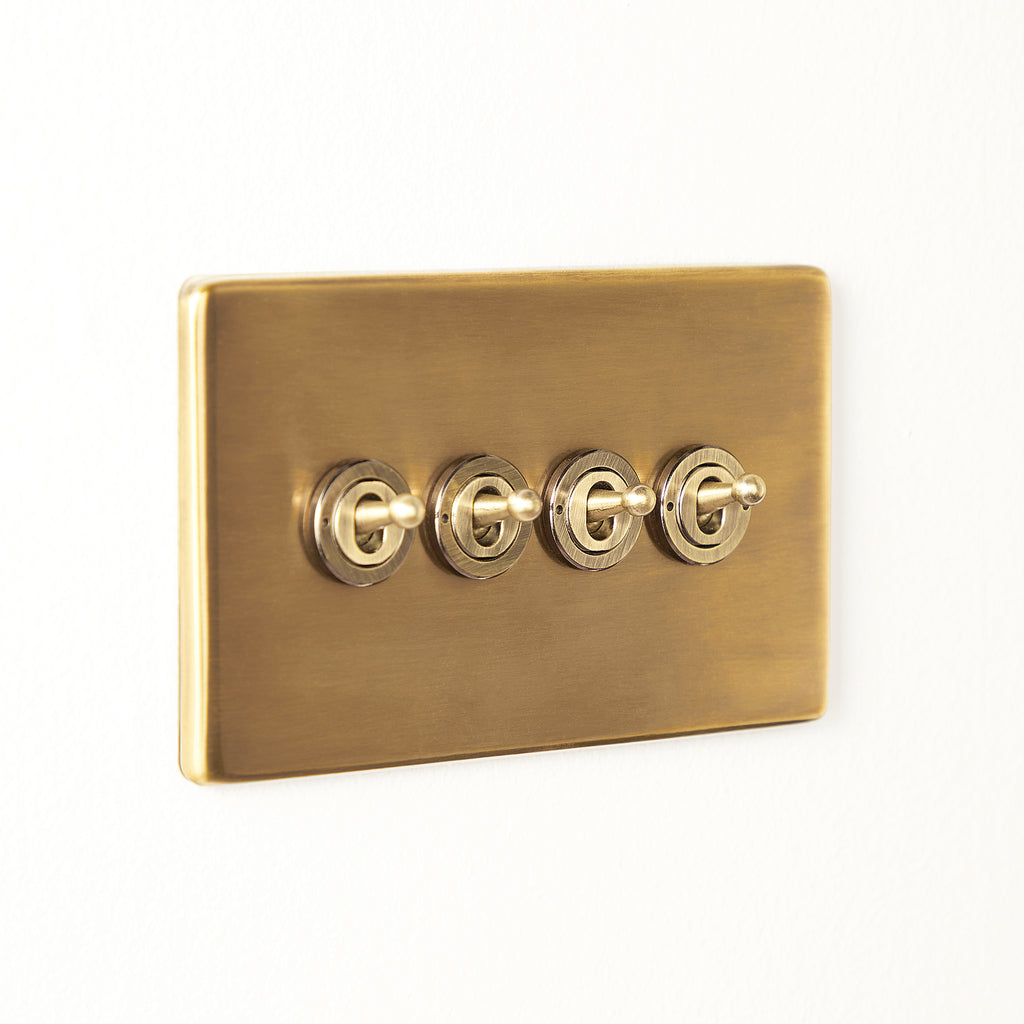 Four gang 2 way Florence toggle switch in brass
