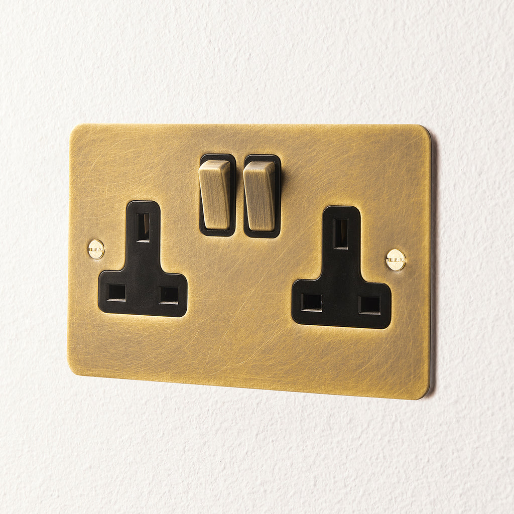 Lucian double socket with black inserts in aged brass