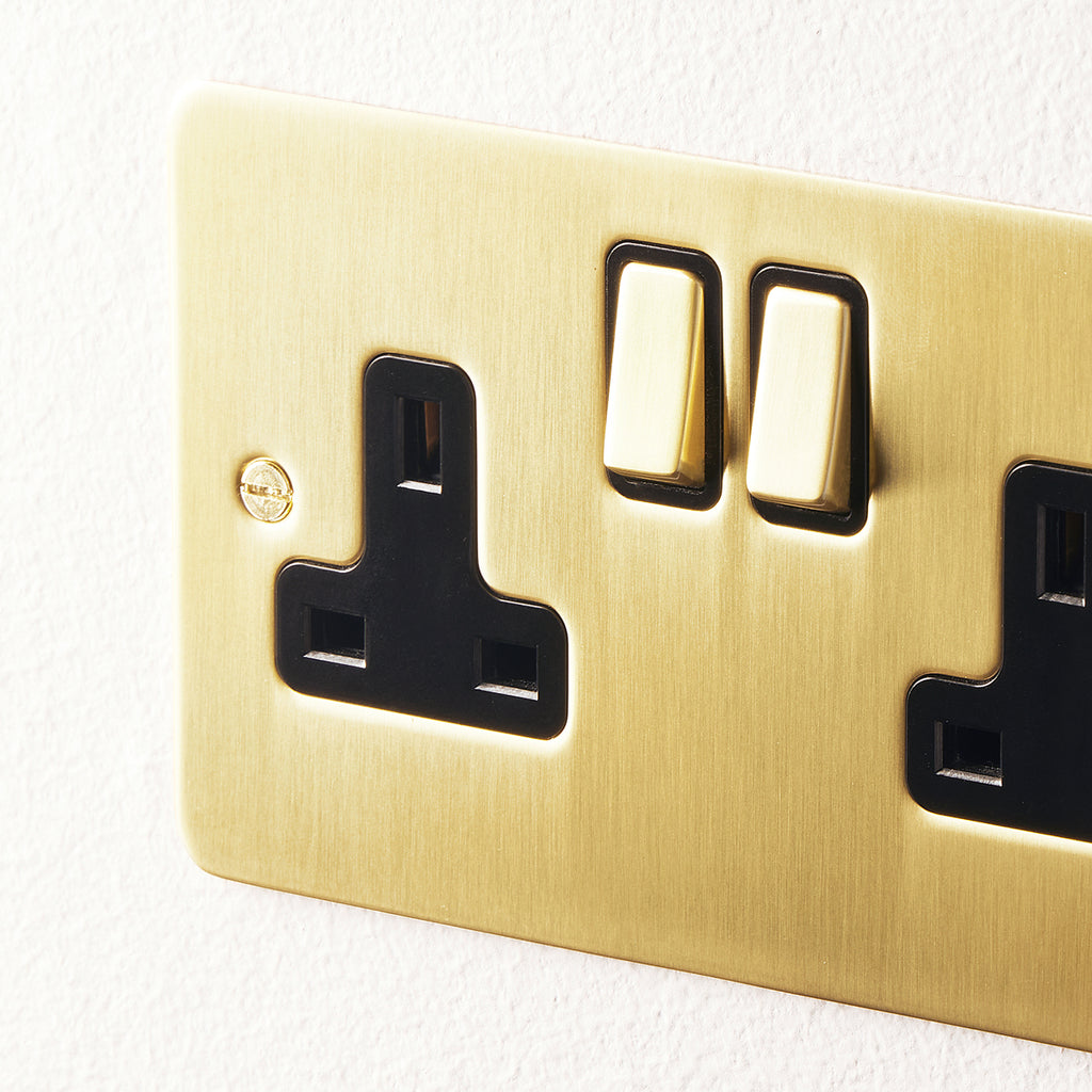 Lucian double socket with black inserts in top brass