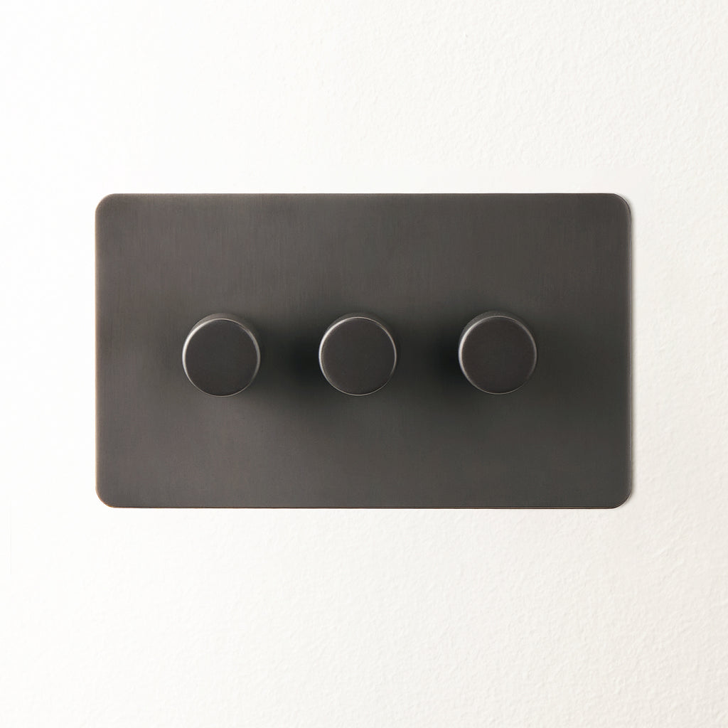 Lucian three gang dimmer switch in bronze
