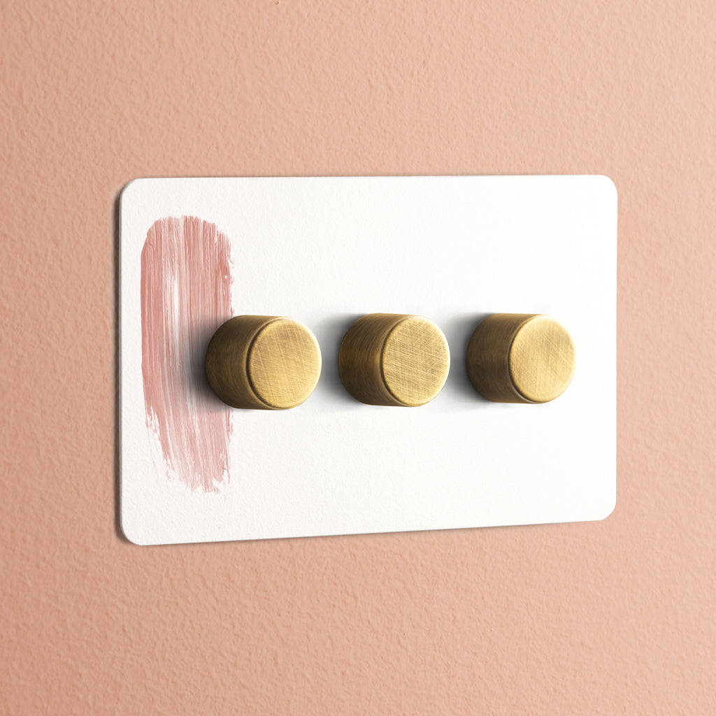 Lucian three gang dimmer switch in a paintable finish