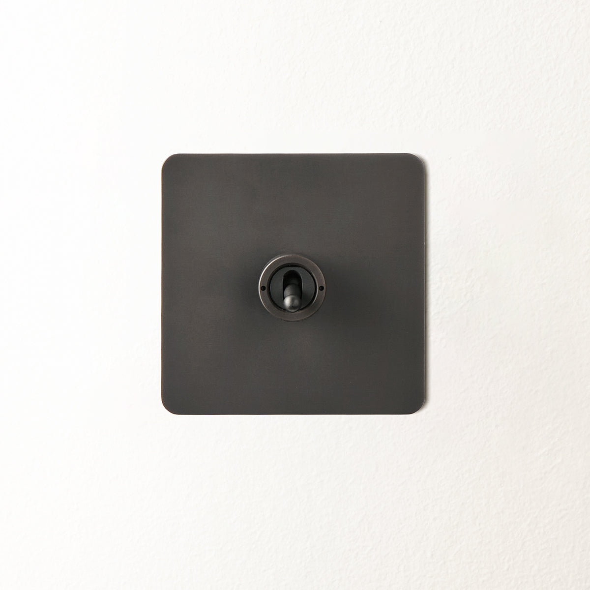 Lucian one gang intermediate toggle switch in bronze