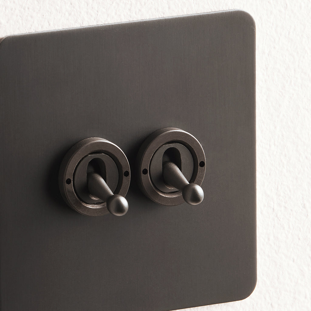 Lucian two gang intermediate toggle switch in bronze