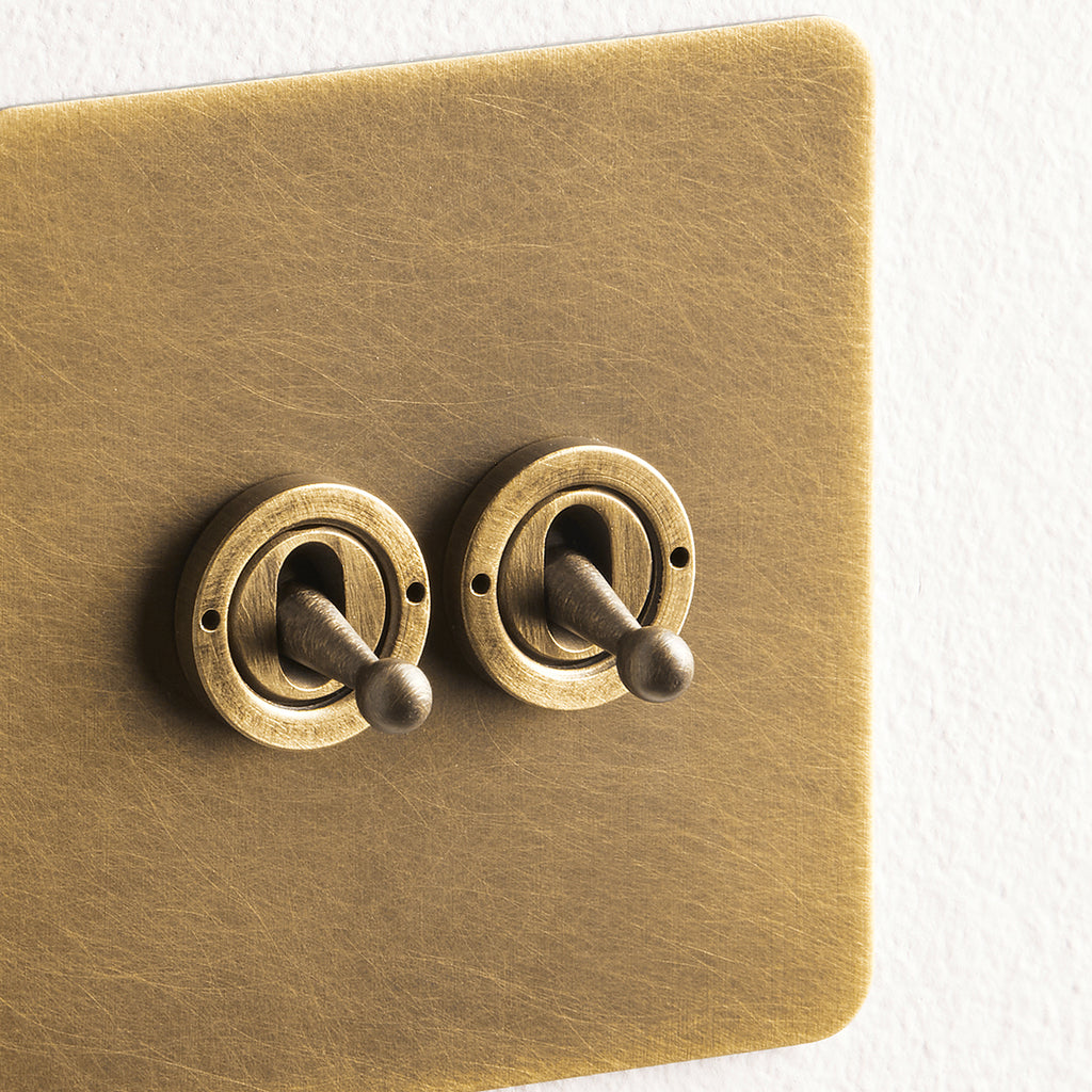 Lucian two gang 2 way toggle switch in aged brass