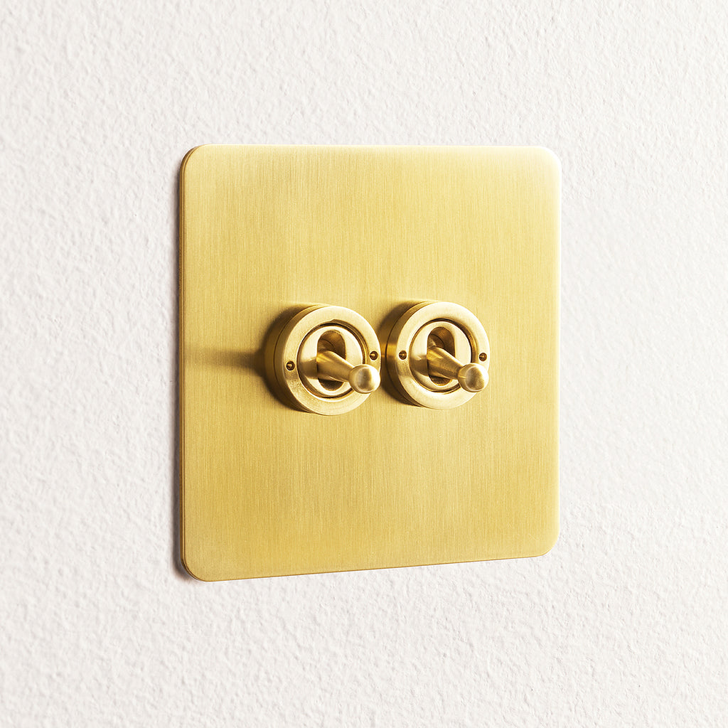 Lucian two gang 2 way toggle switch in top brass