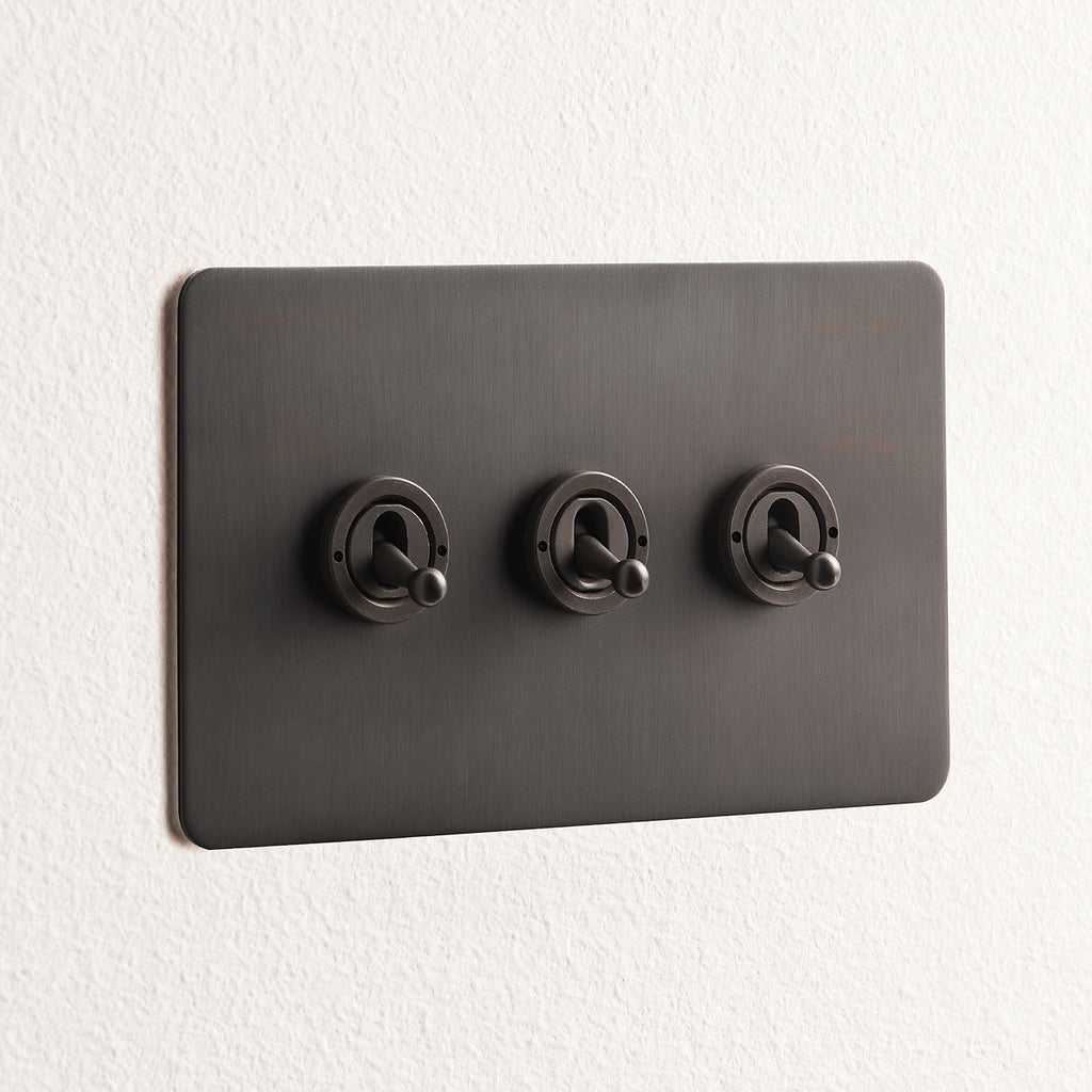 Lucian three gang 2 way toggle switch in bronze