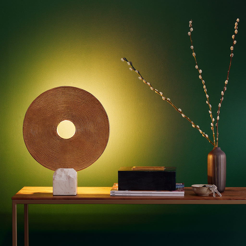 Discus sculptural table lamp in gold and white marble