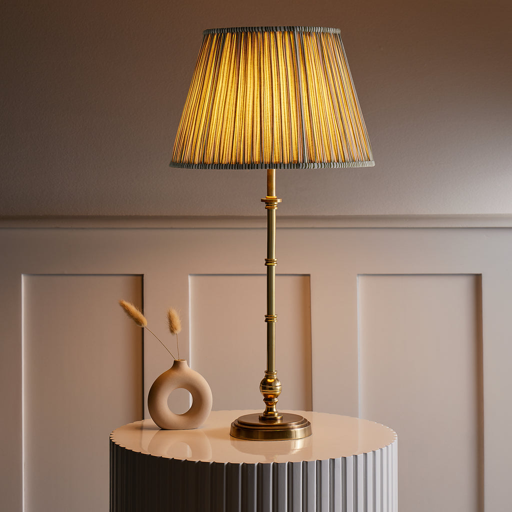 Chukka rechargeable table lamp in antique brass