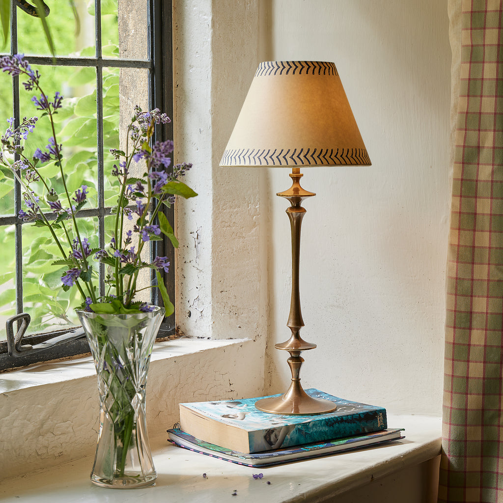 Spindle rechargeable table lamp in aged brass