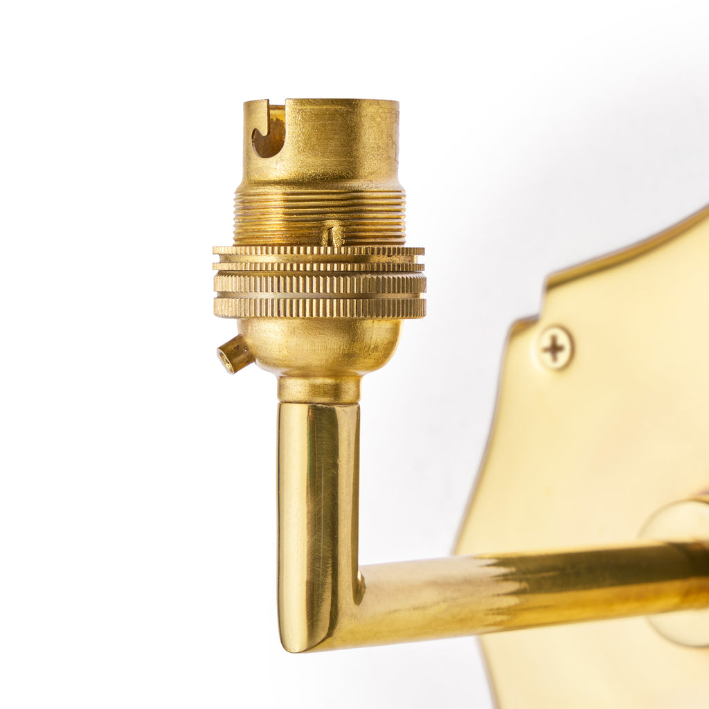 single insignia wall fitting in antique brass