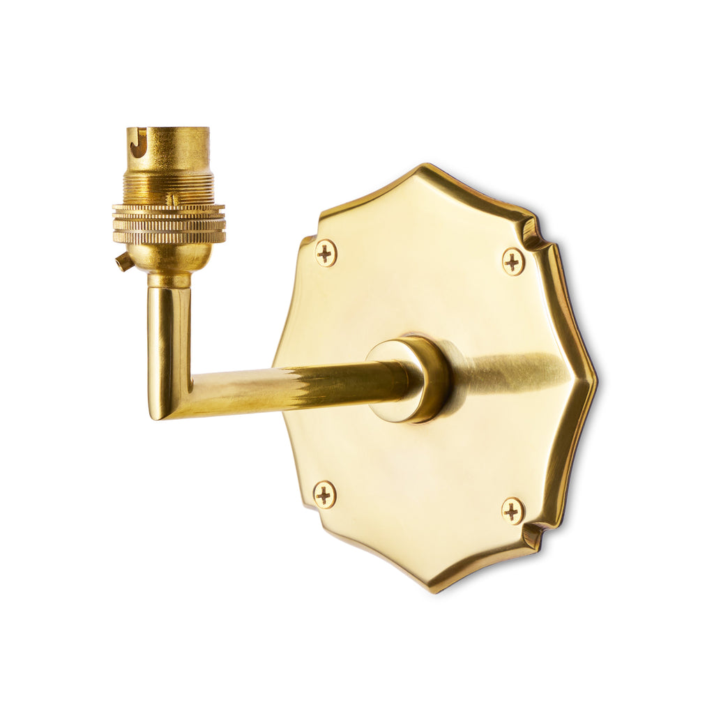 single insignia wall fitting in antique brass