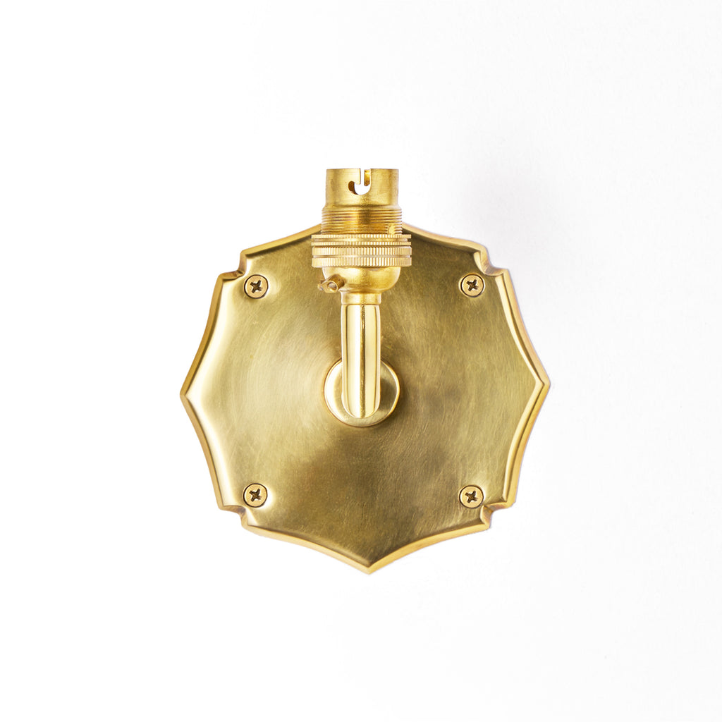 single insignia wall fitting in antique brass