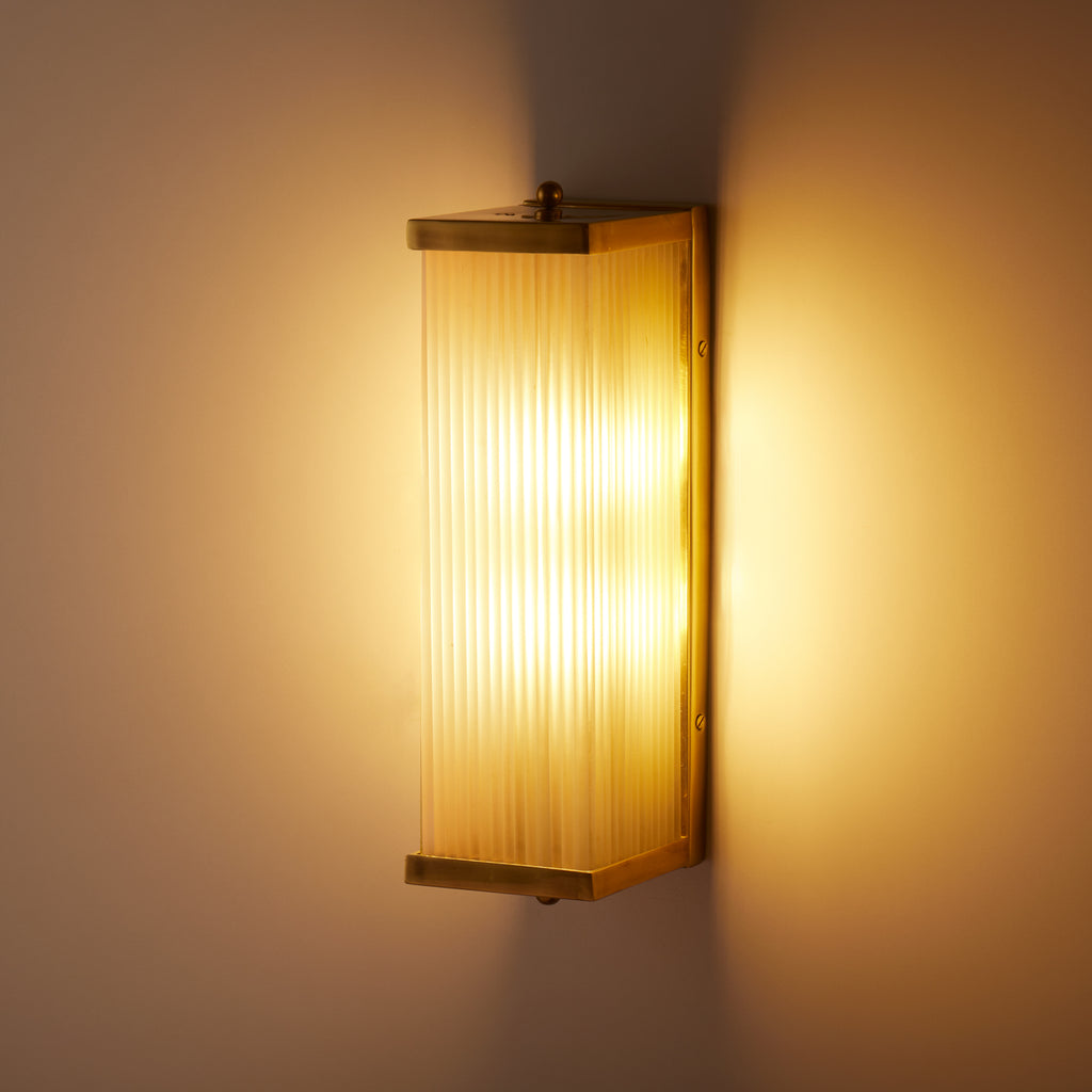 Rectangular Roddy IP44 rated wall light in brass and frosted glass