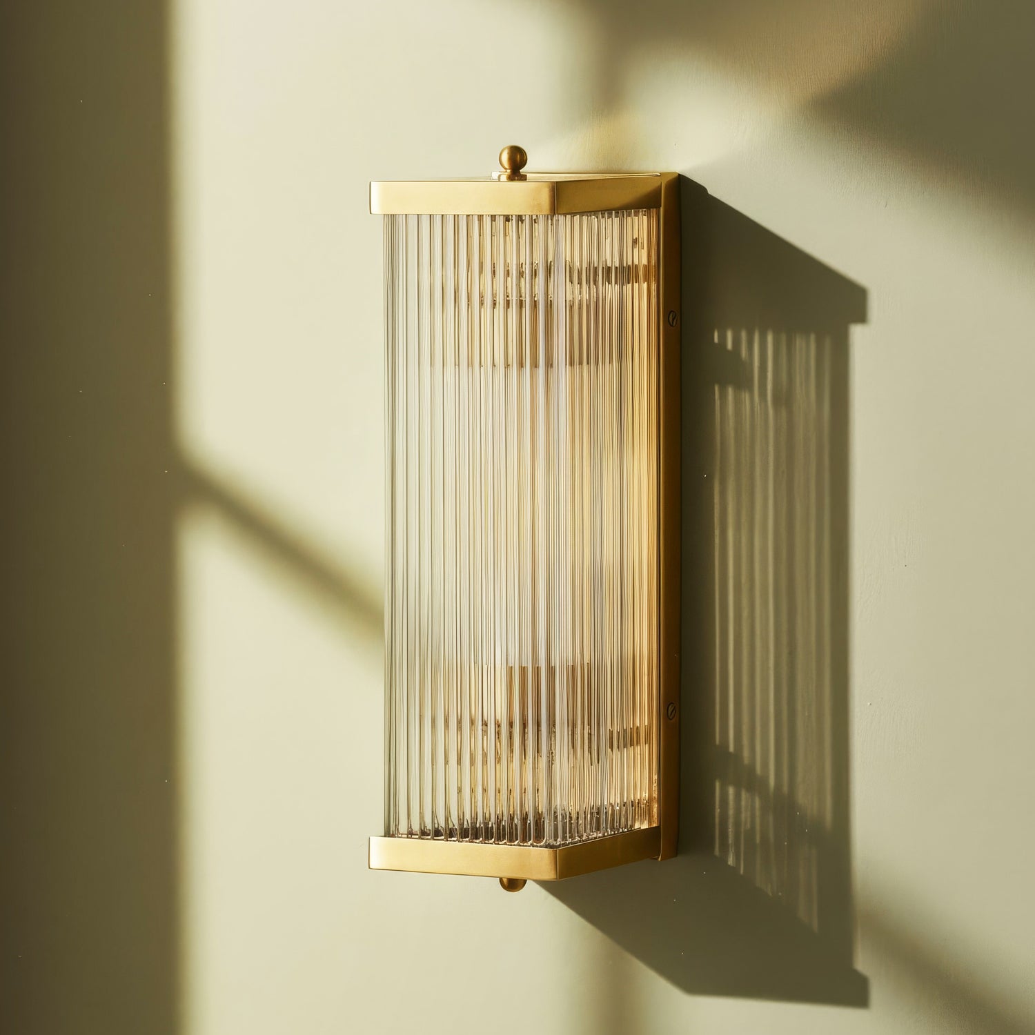 Rectangular Roddy IP44 rated wall light in brass and glass