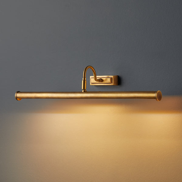 Larger Clyfford picture light in waxed antique brass