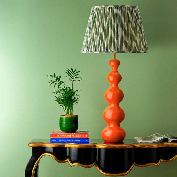 Larger Wobster table lamp in orange lacquered wood